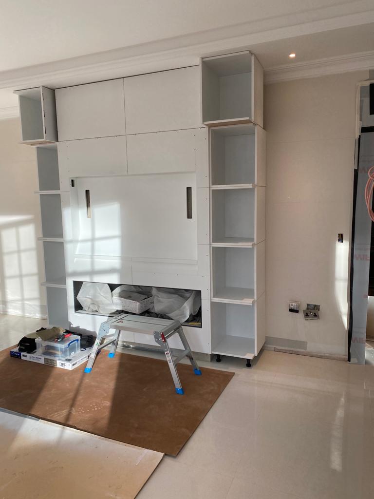 Create a Feature TV Wall in your home: Leather panels, built-in storage ...